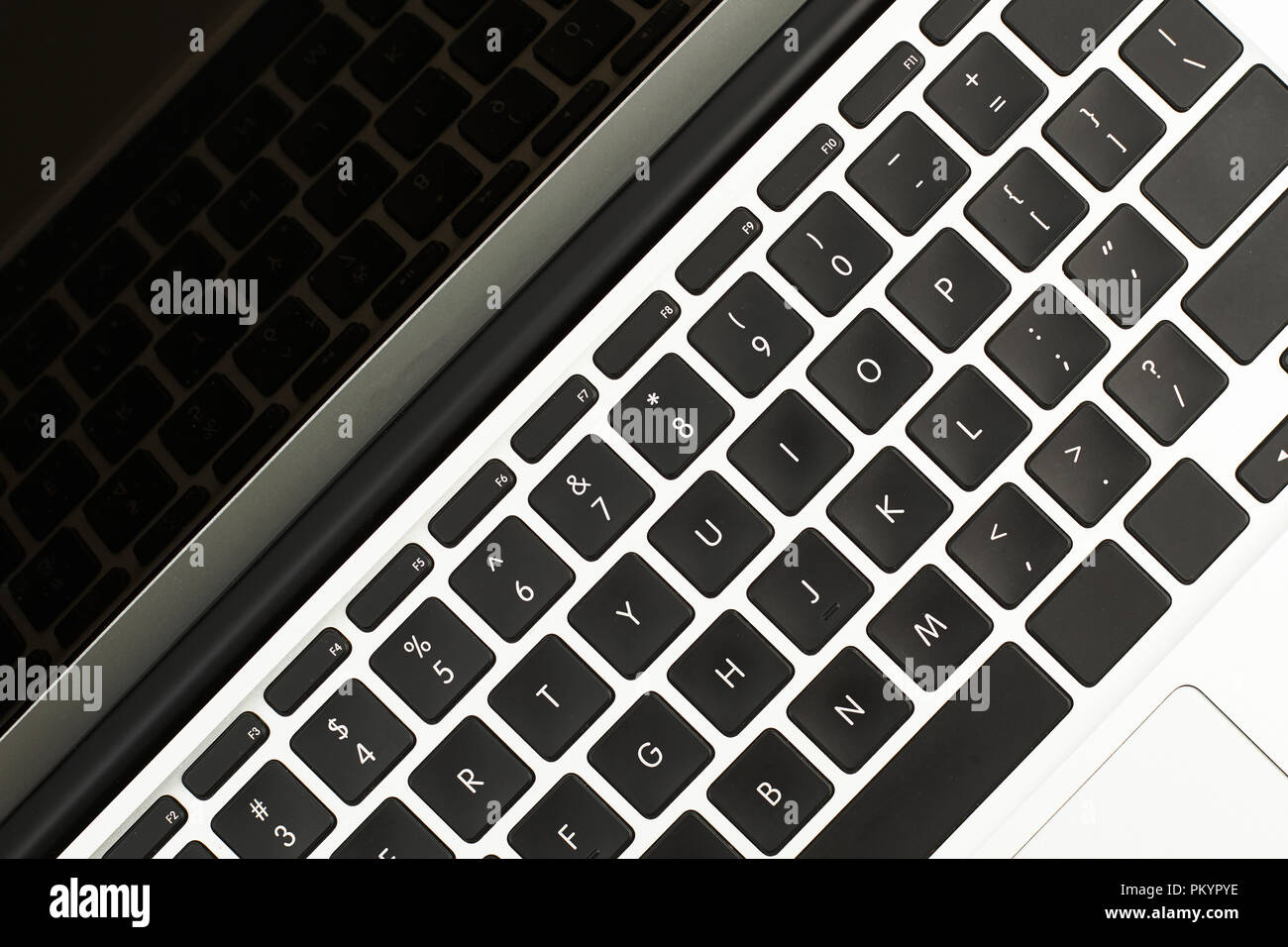 Silver laptop close up. Modern ultra thin notebook close up. Black and ...