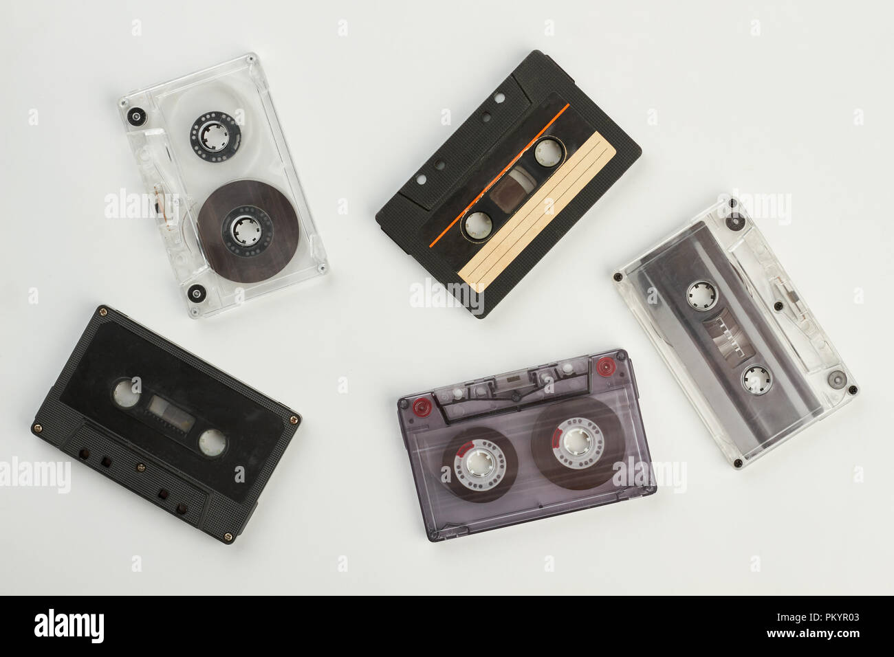 Set of different audio cassette tapes. Five audio tapes on light ...