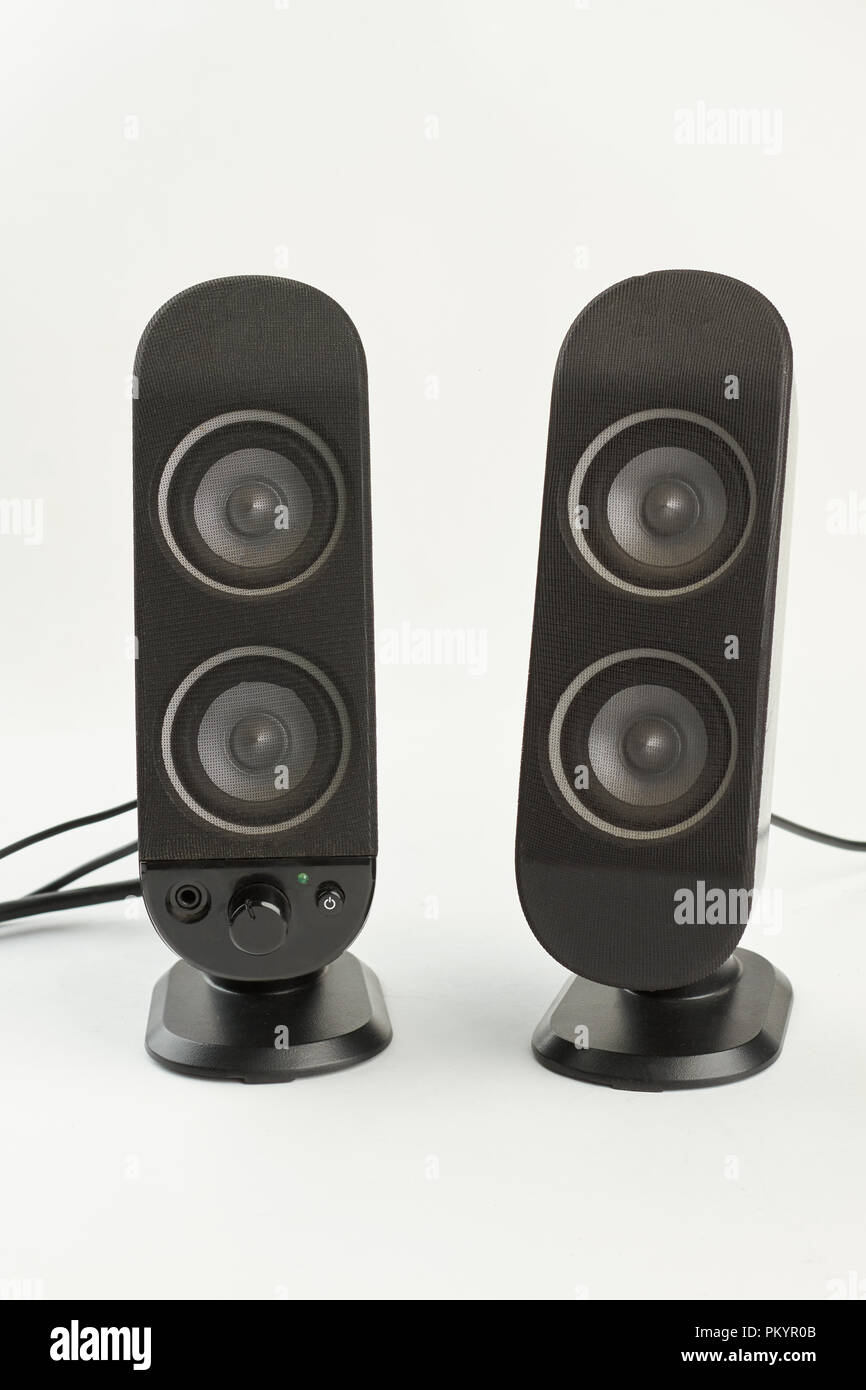 Two sound columns on white background. Pair of professional sound ...