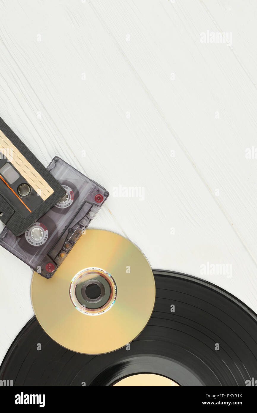 Musical storage devices and text space. Top view on vinyl record, DVD ...