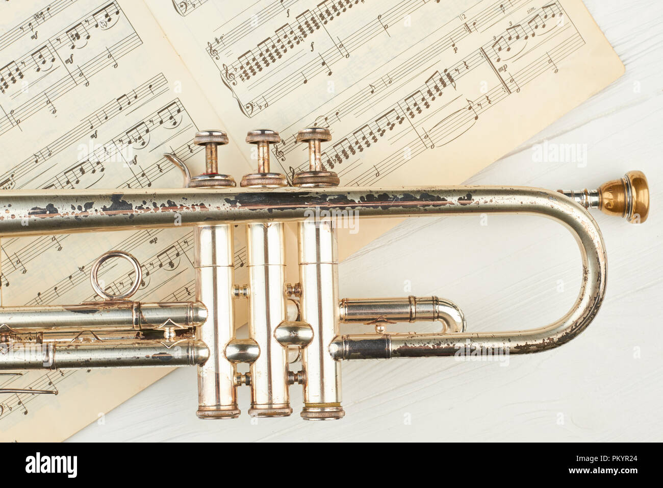 Old rusty trumpet and musical notes. Close up vintage trumpet and ...