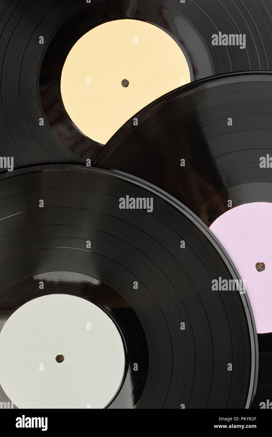 Vinyl records background. Close up vinyl records with different labels ...