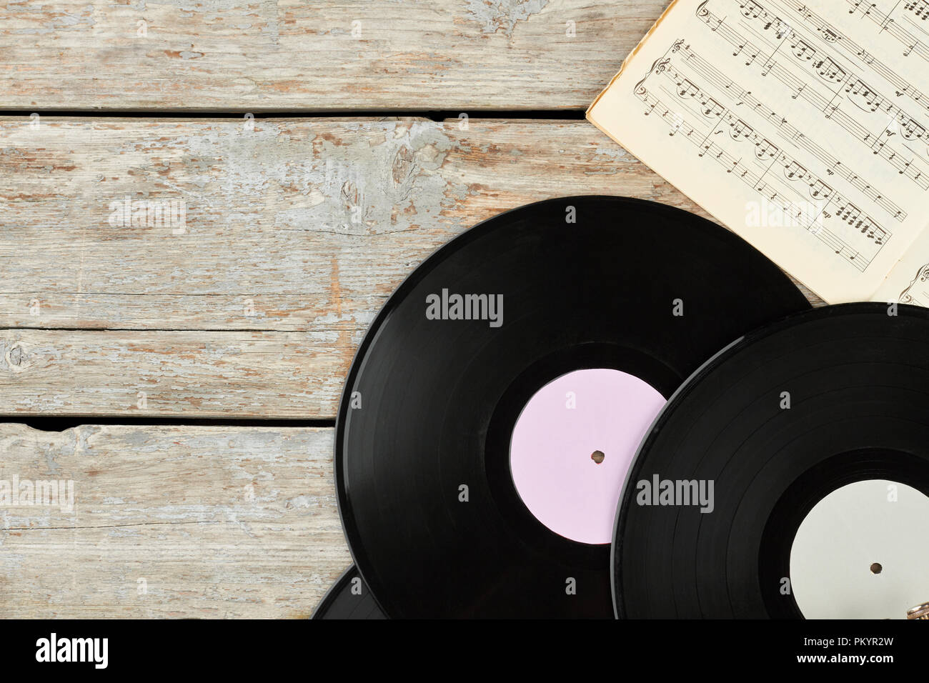 Vinyl records and musical notes. Vinyl long play disc with musical ...