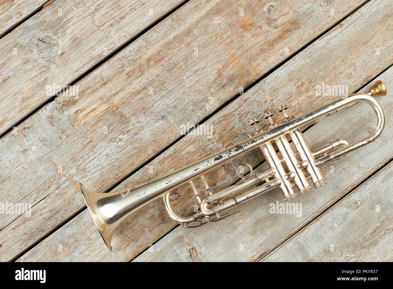 Old trumpet and copy space. Rusty trumpet on old wooden boards ...
