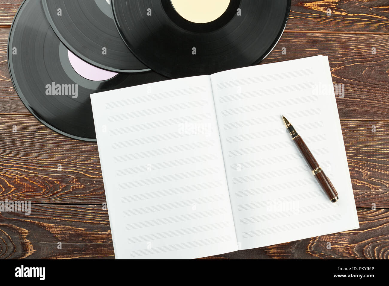 Vinyl records and notebook for music notes. Blank musical note paper ...