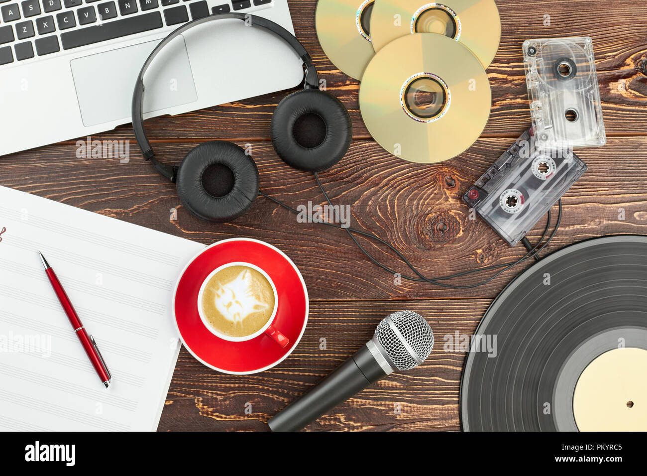 Audio equipment on wooden background. Old and modern media technologies ...