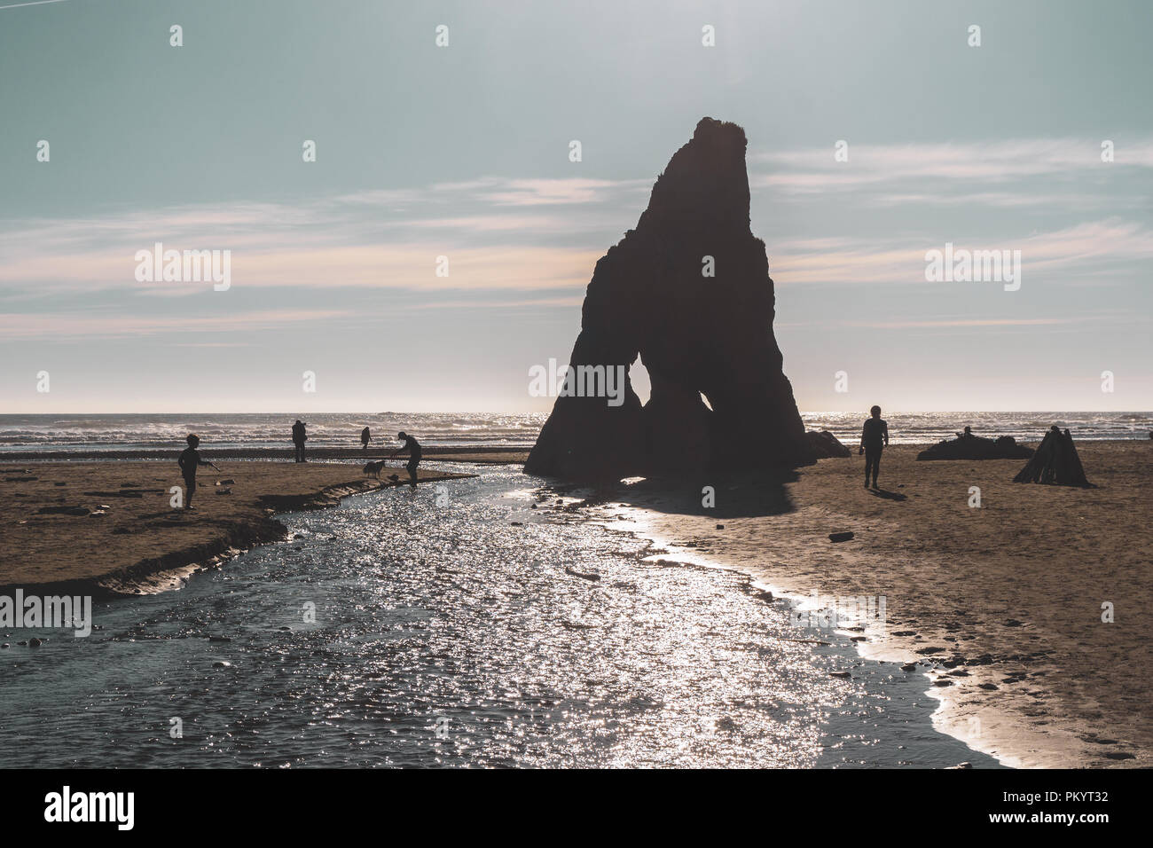 Ruby Beach on late afternoon with silhouetted people enjoying the day ...