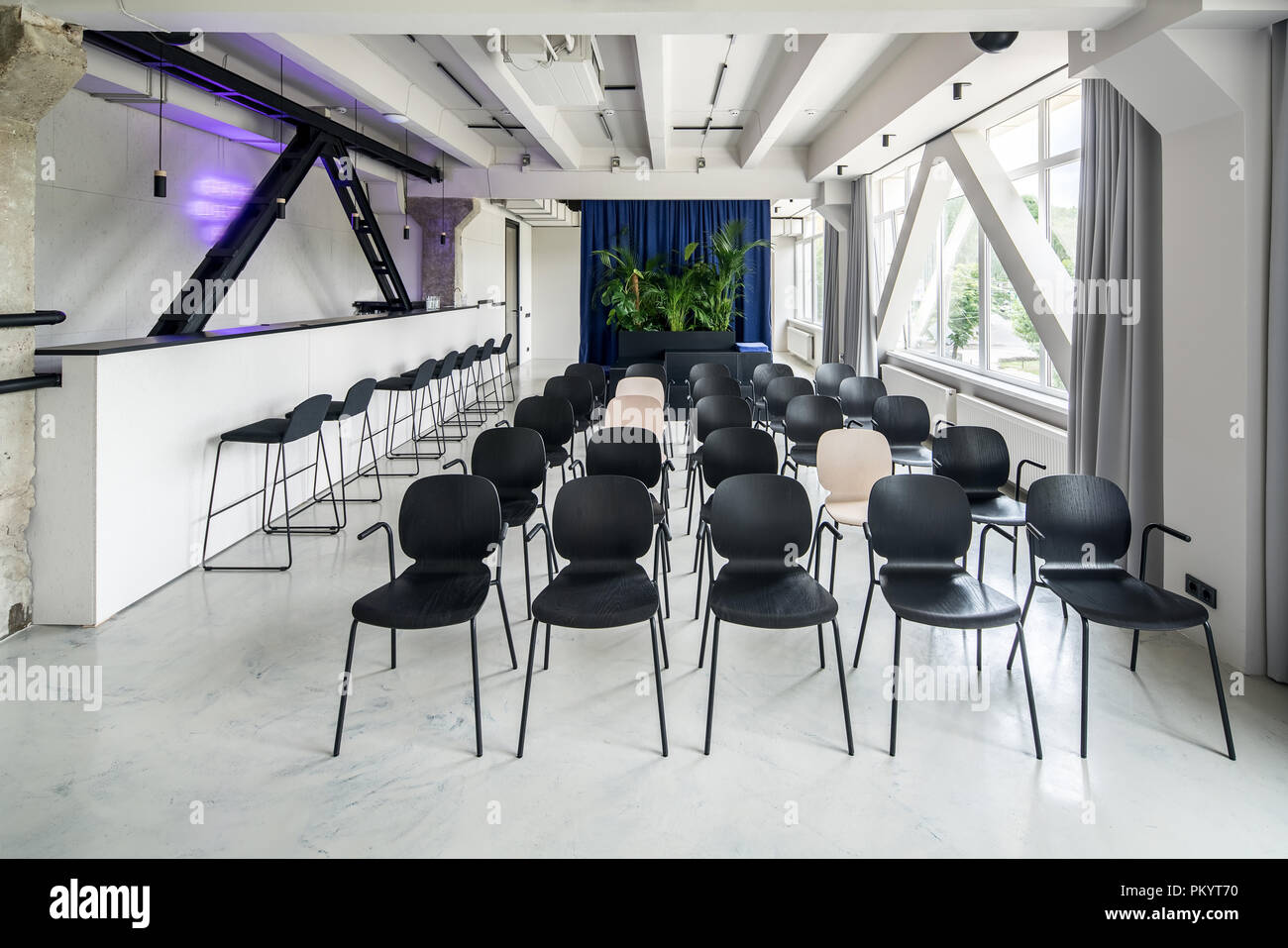 Stylish conference hall in a loft style with gray walls and concrete ...
