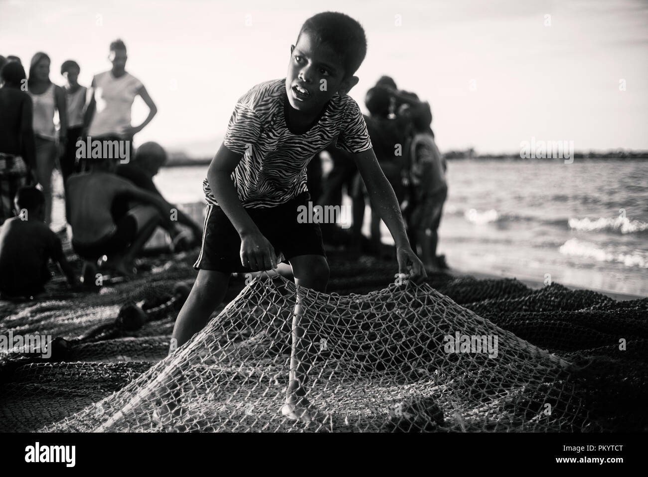 Child holding fishing net Stock Photo - Alamy