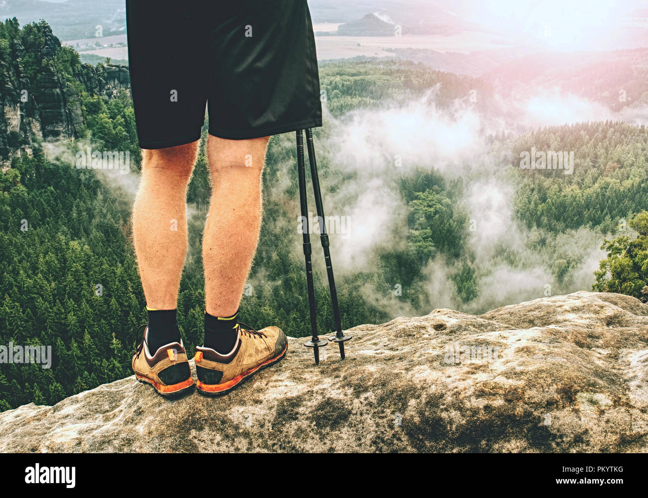 Hiker legs hiking in fall nature. Guy just relax on mountain top and ...