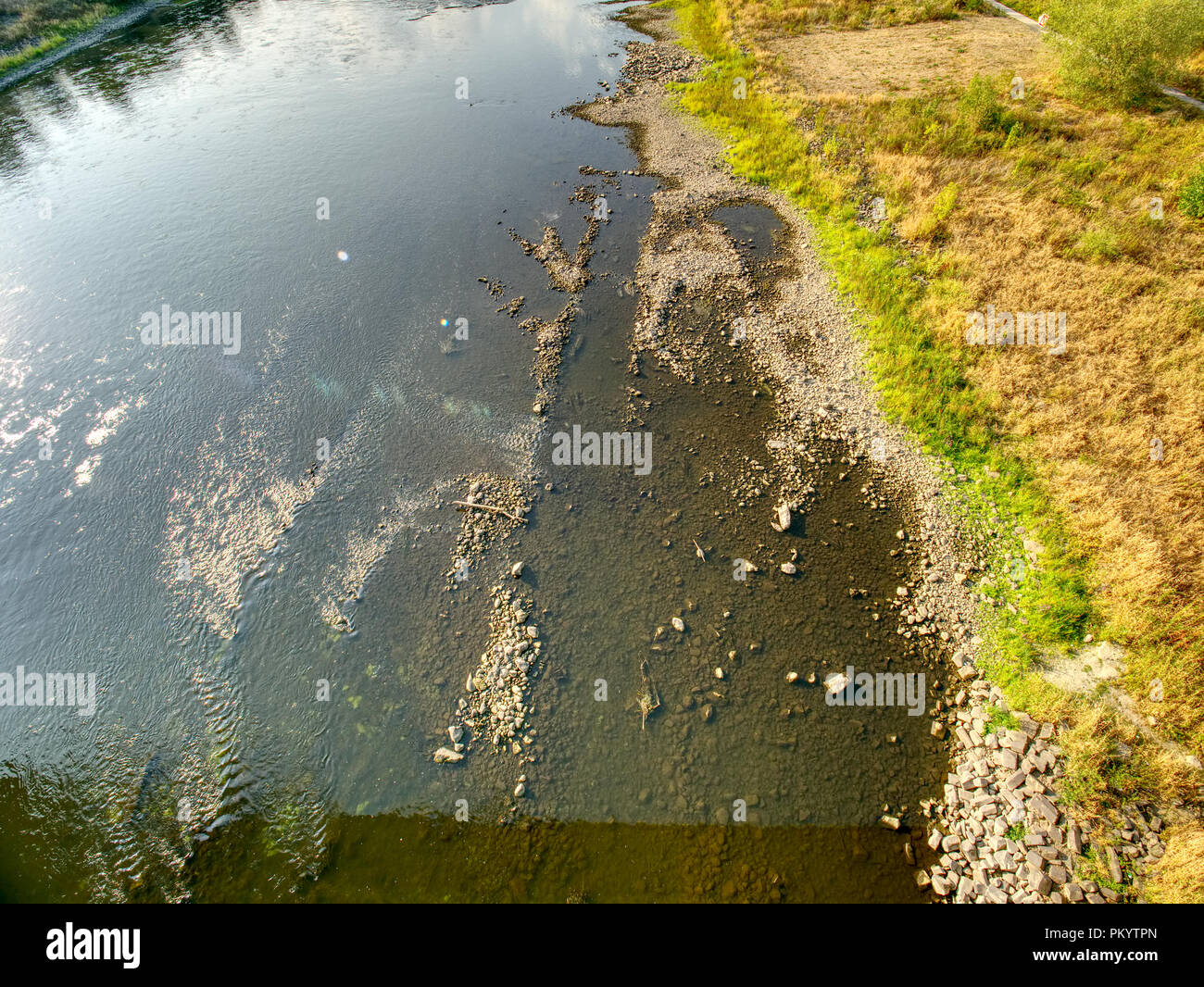 Empty river. Drying out of big river. Horrible smell of poisoned muddy ...
