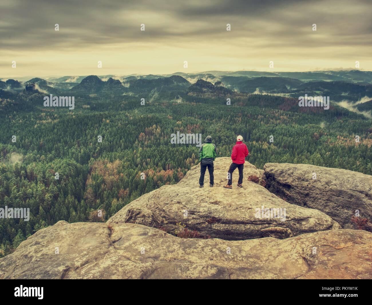 Outdoor shot of talented hobby photographers taking pictures in rocks ...
