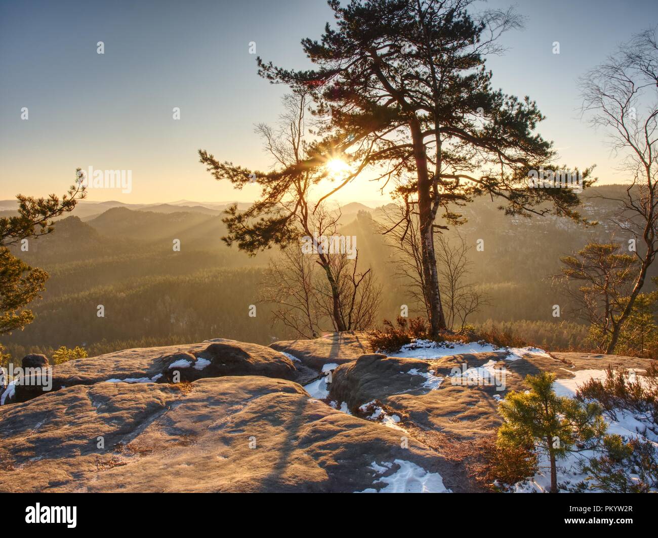 Spring melting of latest snow on exposed sandstone rocks. Hot spring ...