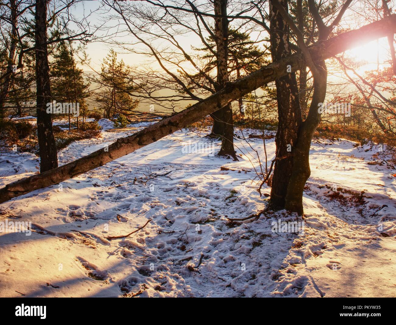 Spring melting of latest snow on exposed sandstone rocks. Hot spring ...
