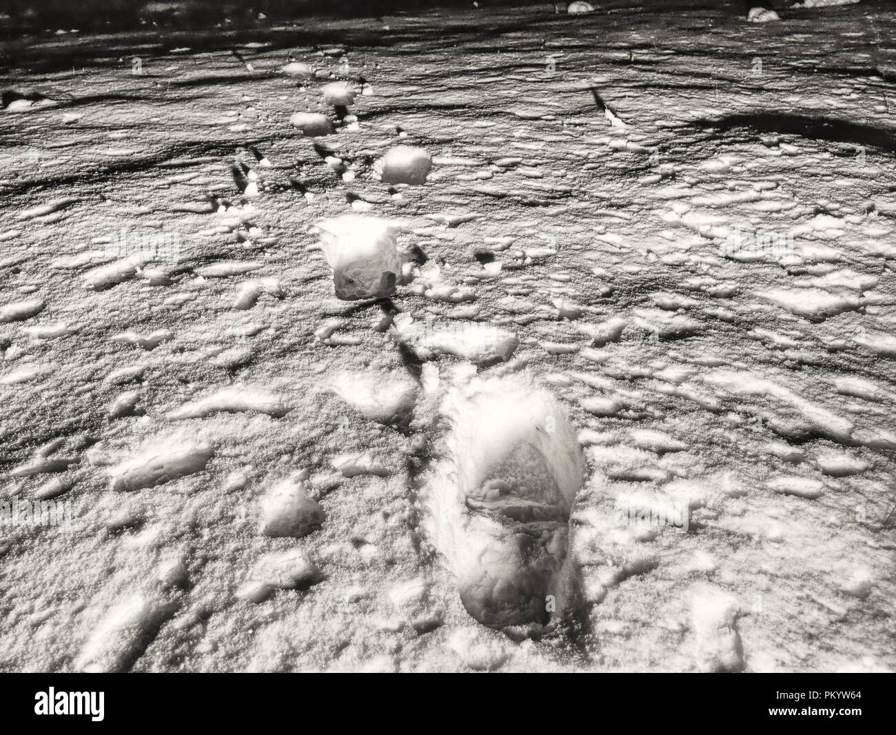 Footprints on fresh snow by night vanishing in the dark. Fear in ...
