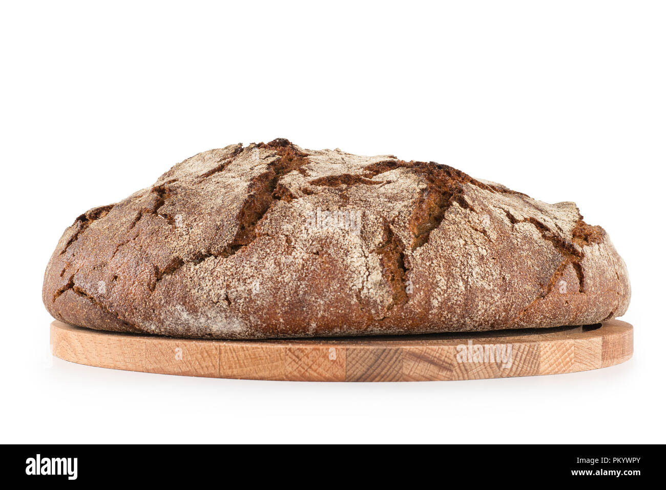 Round freshly baked rustic rye round bread on the wooden cutting board ...