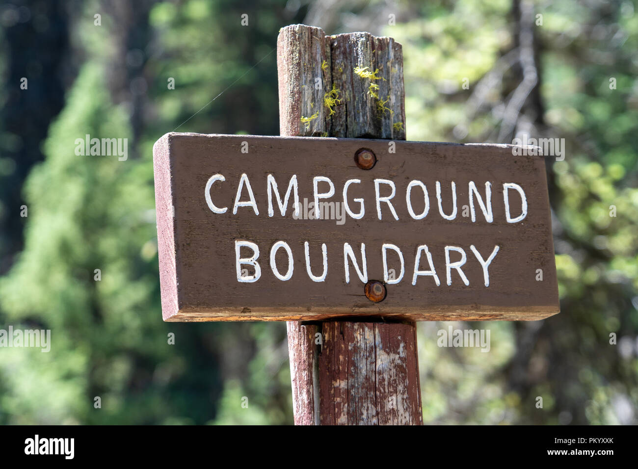 Sign for a campground boundary Stock Photo - Alamy
