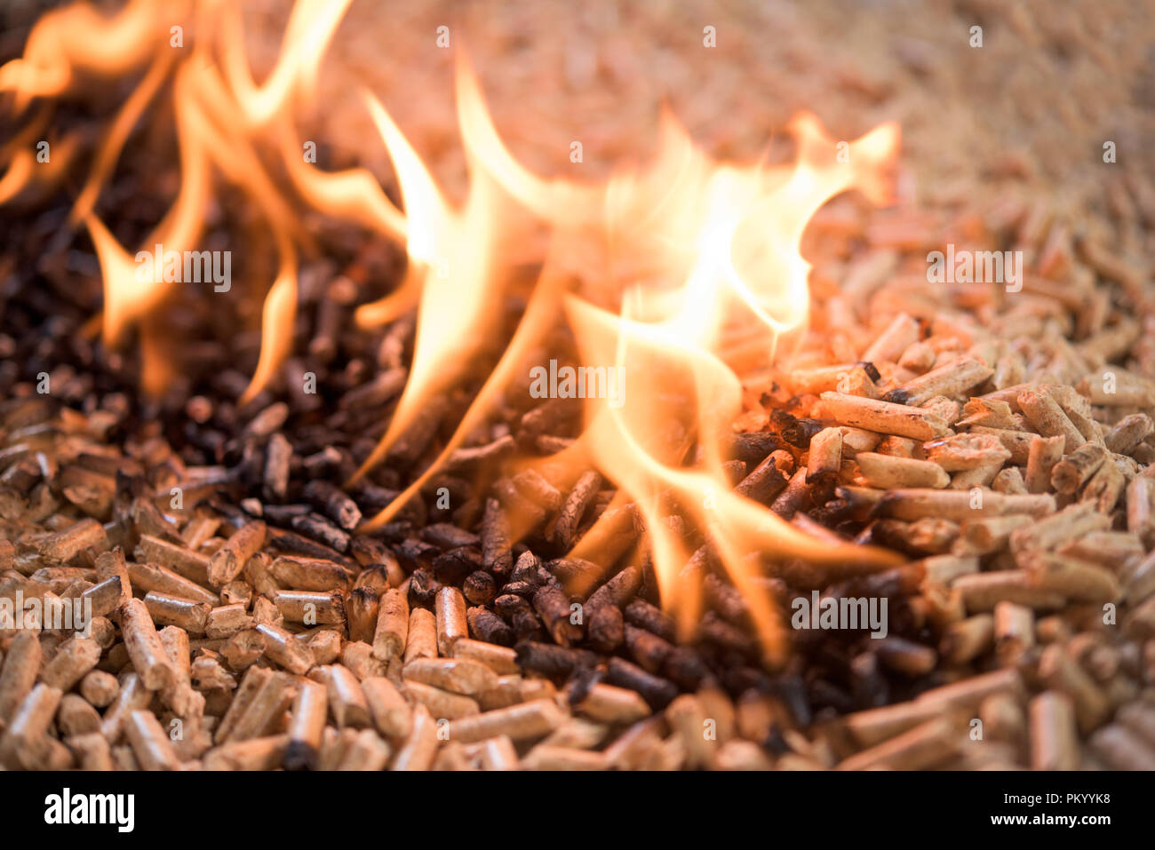 Pile of burning beech pellets - home heating Stock Photo - Alamy