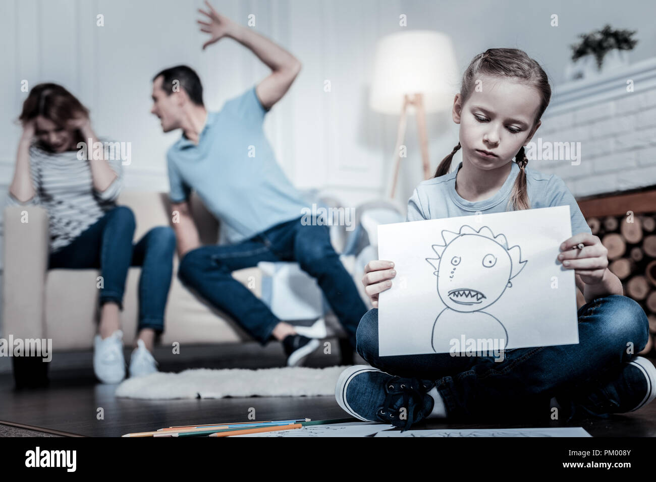 Exhausted child sitting on the floor Stock Photo - Alamy