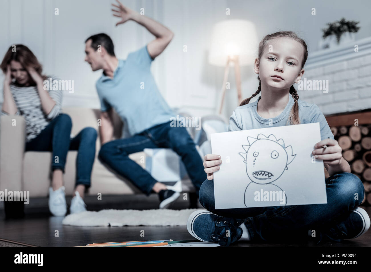 Indifferent kid showing a picture Stock Photo - Alamy