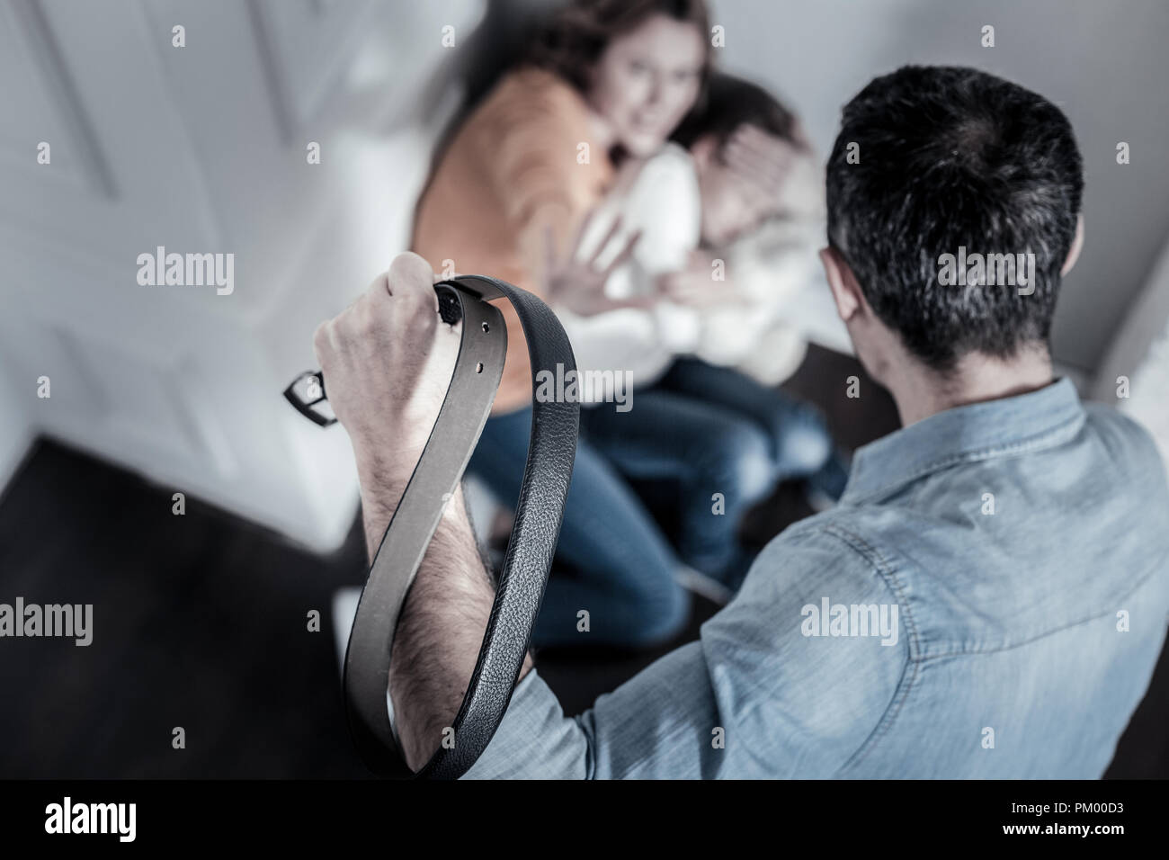 Angry man hitting his family Stock Photo - Alamy