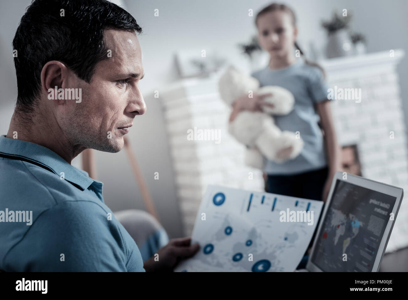 Concentrated man working at home Stock Photo - Alamy