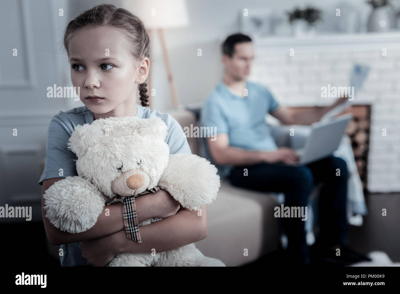 Sweet kid feeling lonely Stock Photo - Alamy