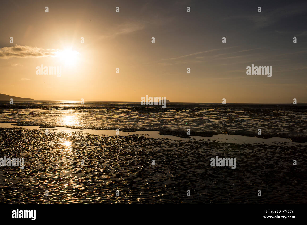 Sunset on the beach Stock Photo - Alamy