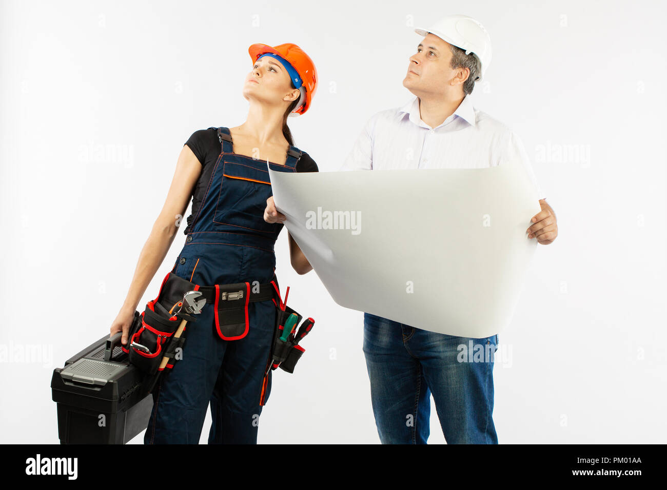 Portrait Of Male Architect And builder Woman Discussing building plan ...
