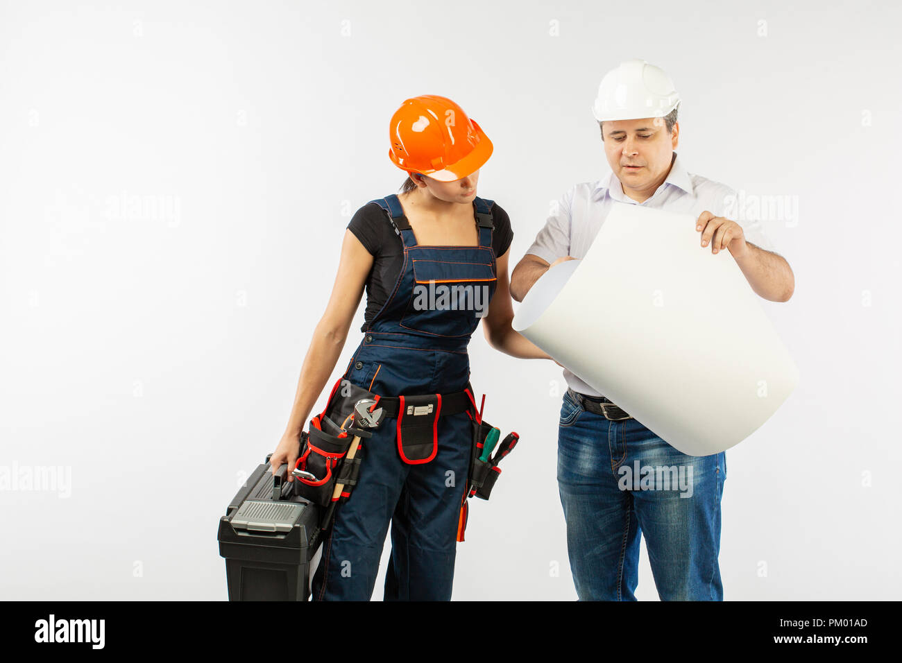 Portrait Of Male Architect And builder Woman Discussing building plan ...