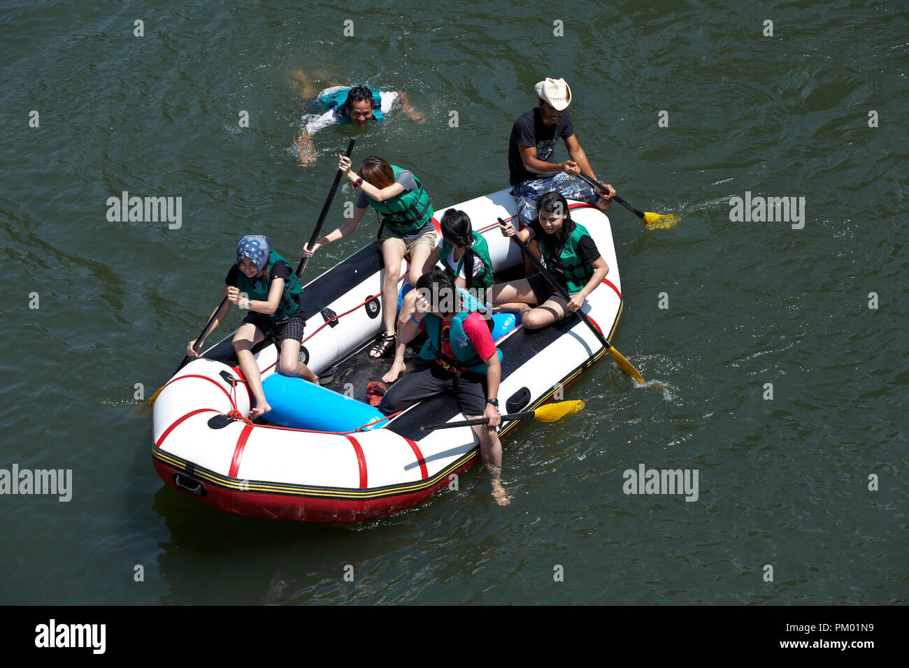 Inflatable dinghy, Group of people on an inflatable rubber dinghy Stock ...