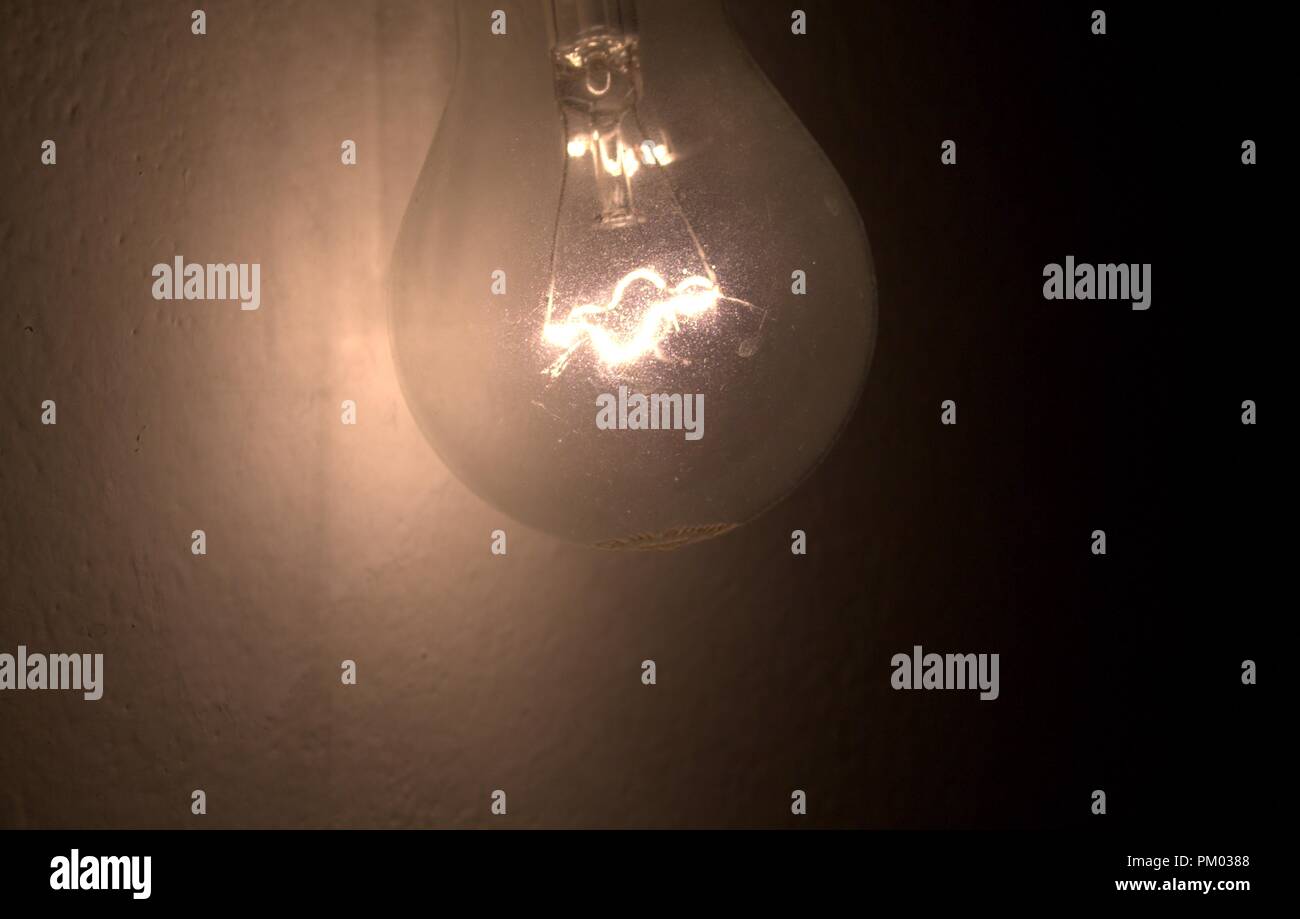 Lit light bulb Stock Photo - Alamy