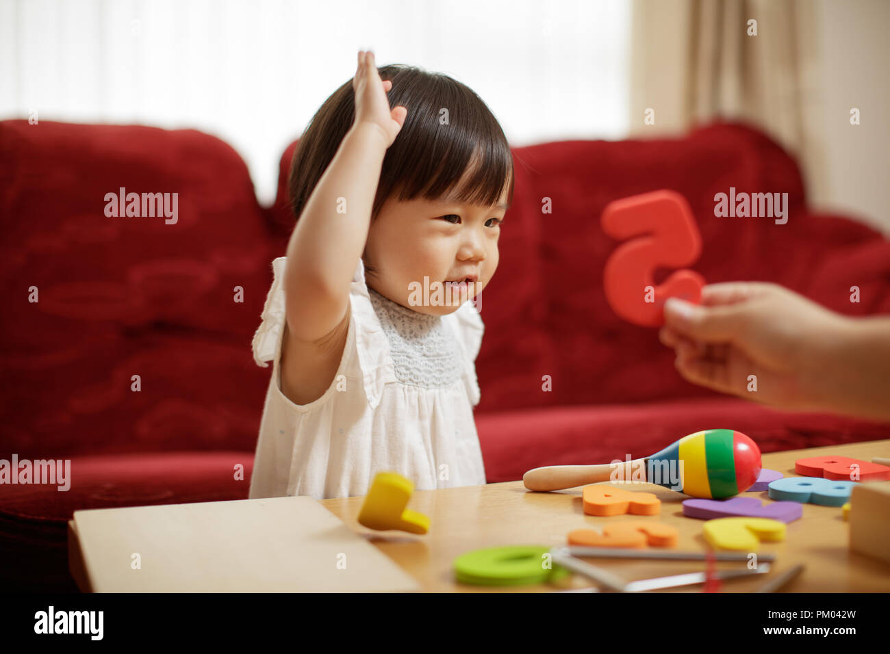 baby girl learning numbers at home Stock Photo - Alamy