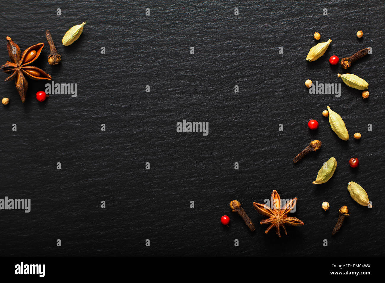 Food presentation background organic various exotic spieces on black ...