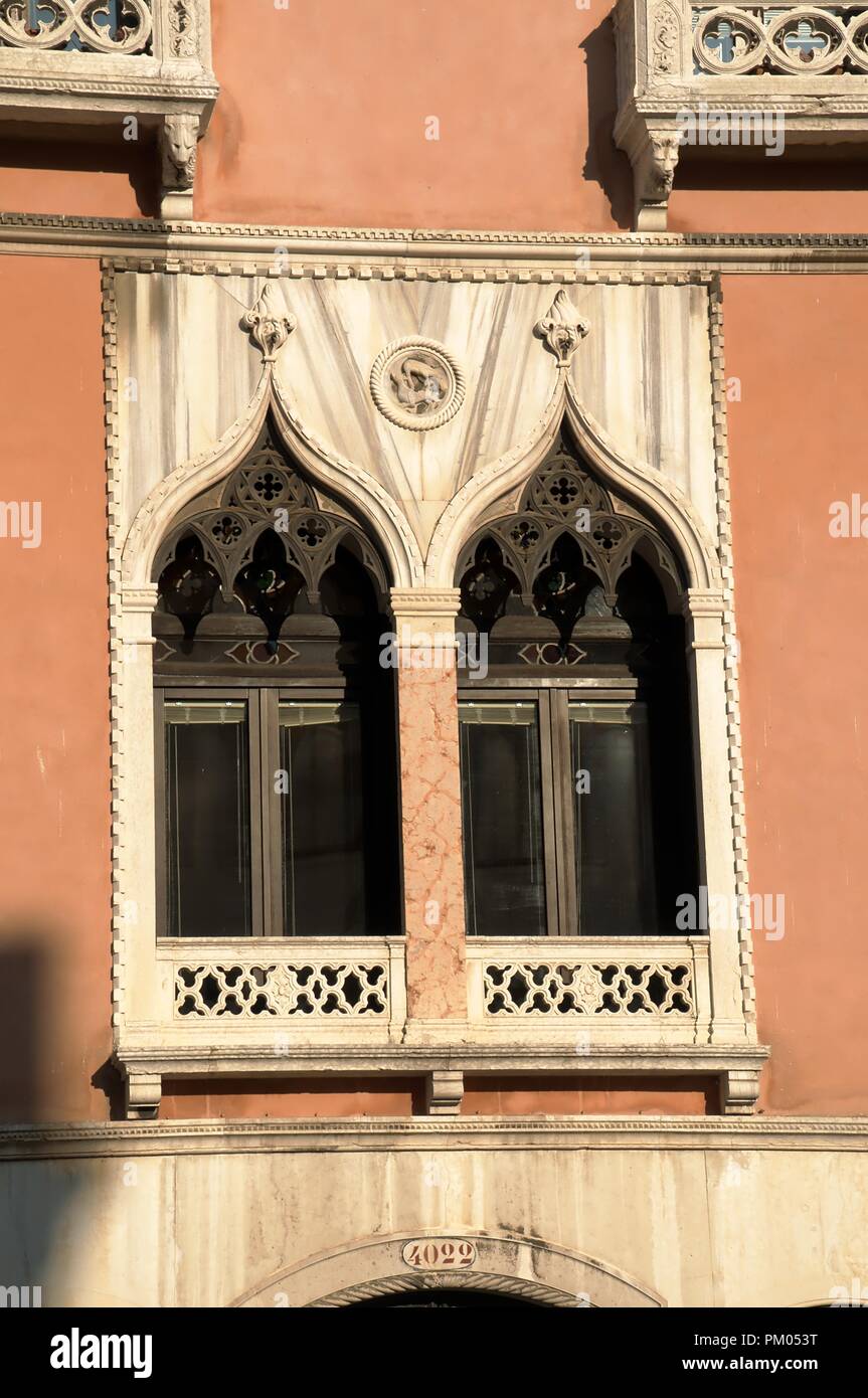 Traditional Venetian arched windows in sunlight Stock Photo - Alamy