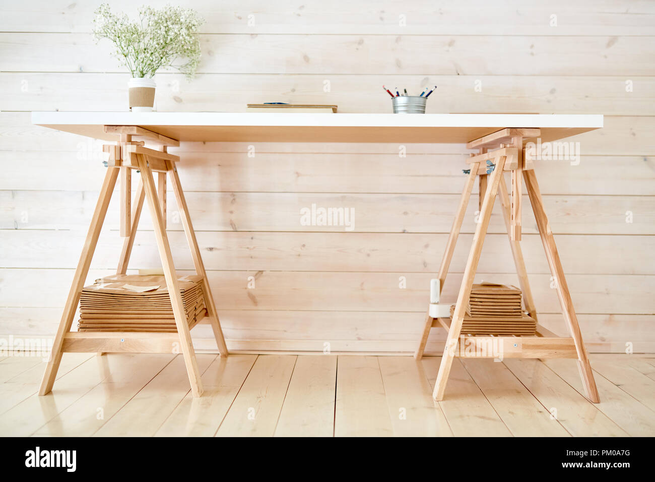 Wooden floor and wall of modern studio and desk supplies for creative ...