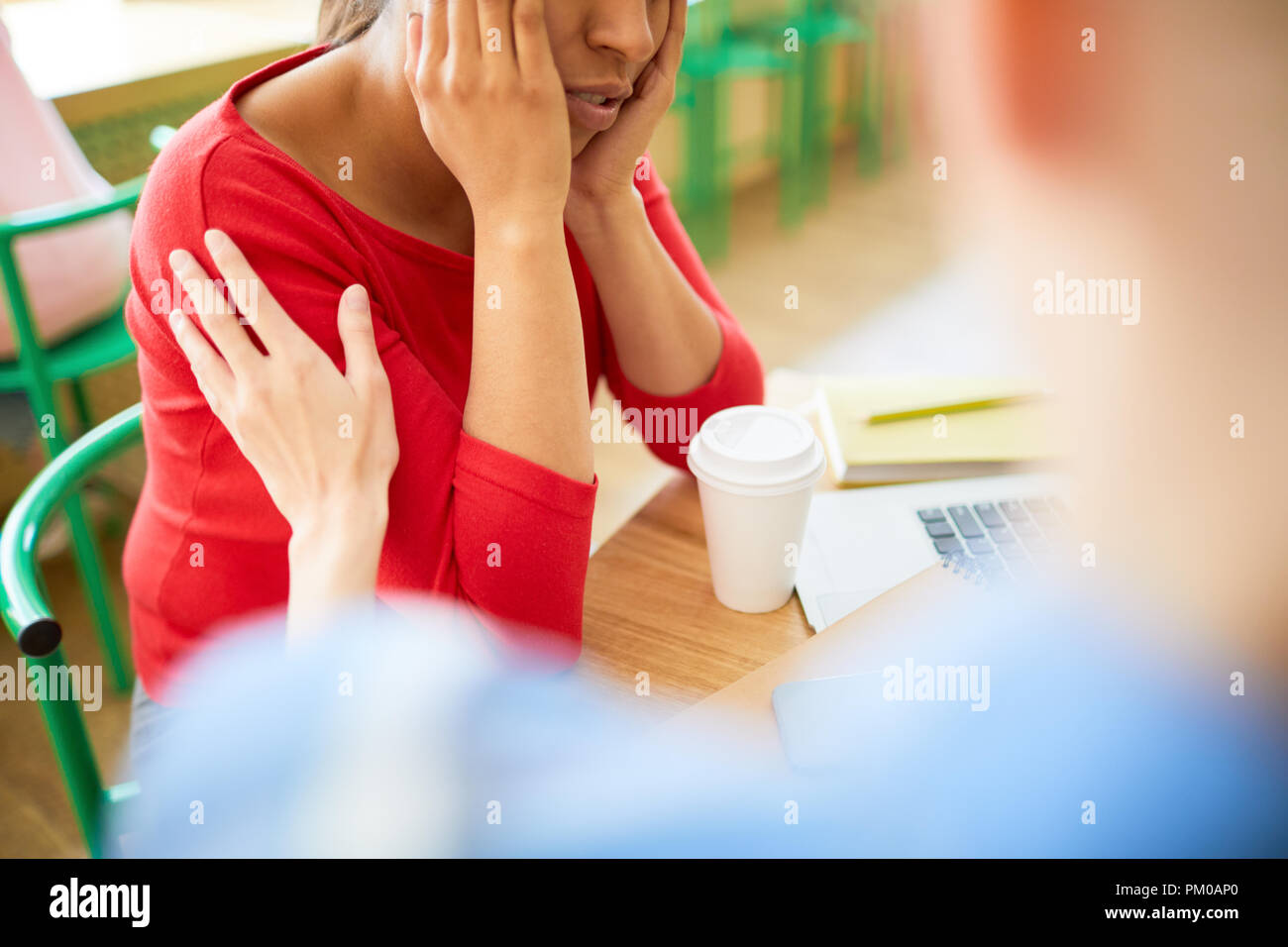 Upset or tired woman complaining about her problems while her friend ...