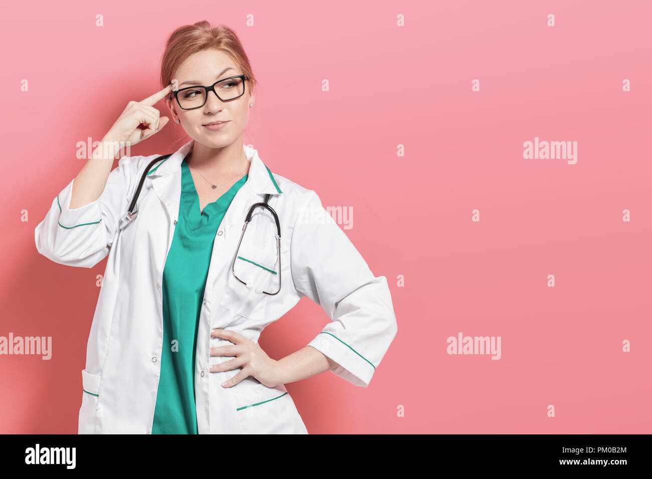 Young woman doctor solves a problem. Photo with copyspace for your text ...