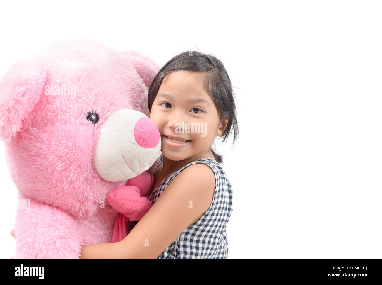 Cute girl hugging pink teddy bear isolated on white background Stock ...