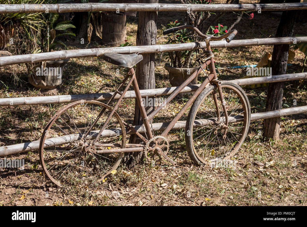 Old rusty vintage bicycle near the concrete wall Stock Photo - Alamy