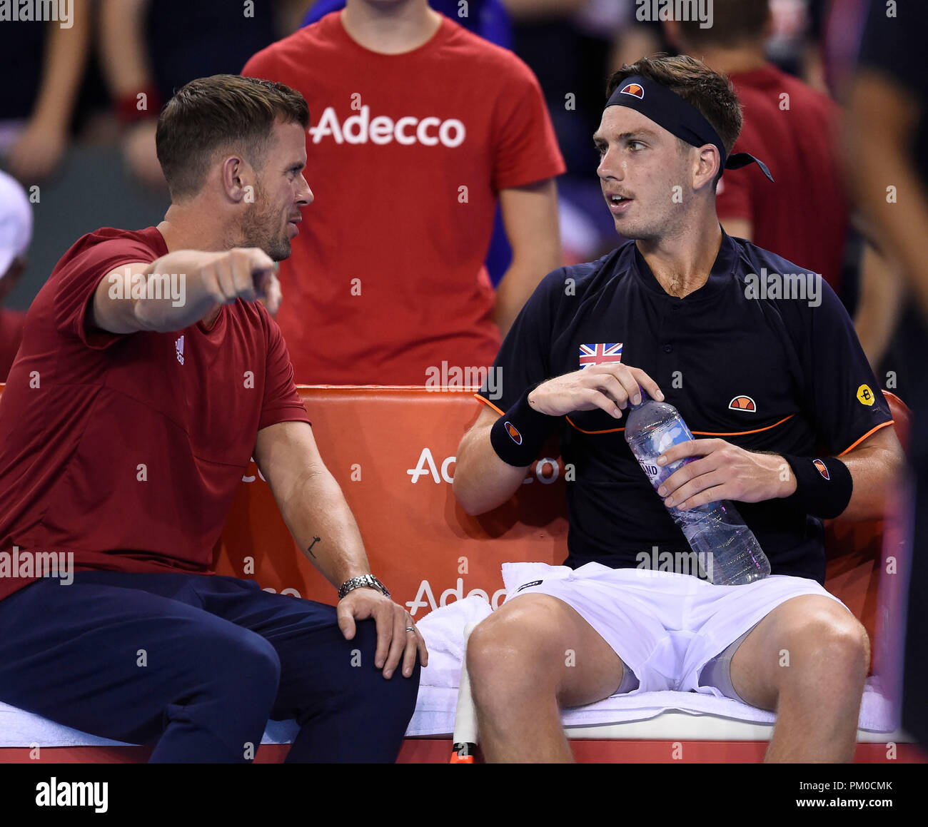 Great Britain captain Leon Smith (left) and Cameron Norrie during day ...