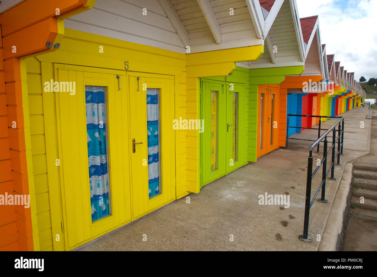 Cheerful beach huts hi-res stock photography and images - Alamy