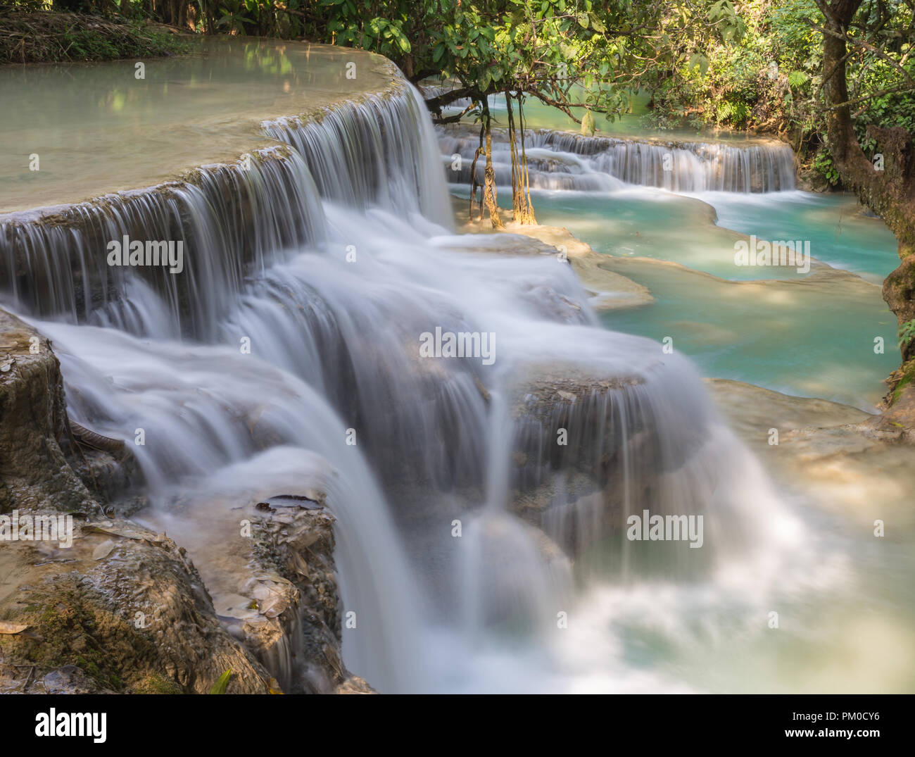 Waterfall in deep rain forest jungle Stock Photo - Alamy