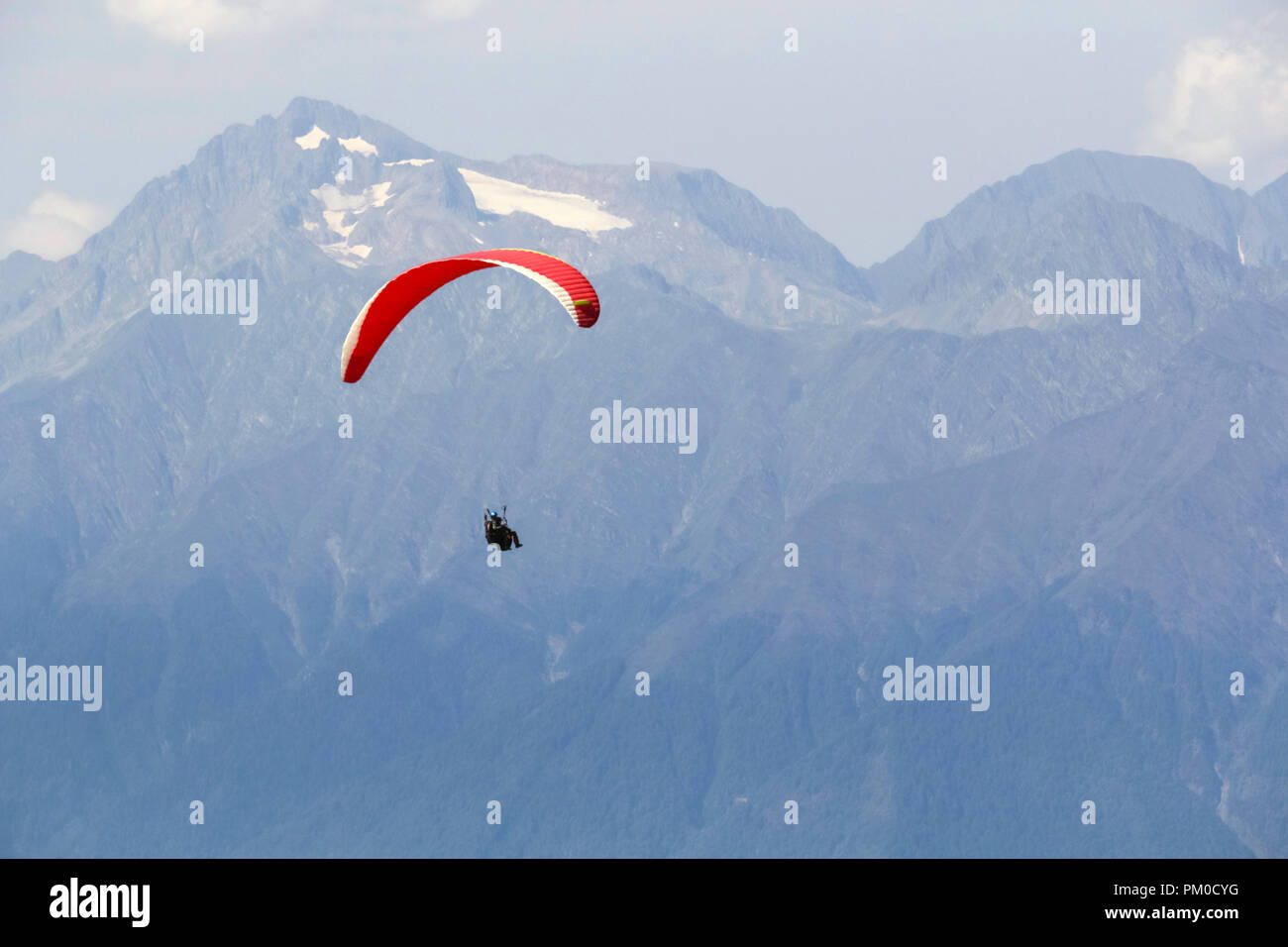 Paraplane on the blue sky background. A man flies on paraplane. Clear ...