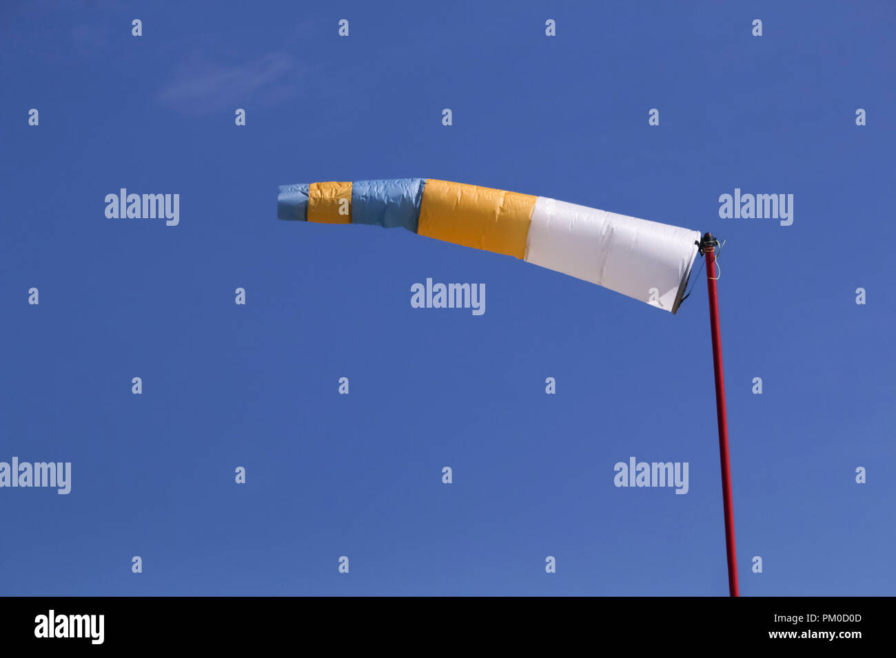 Windsock the cloudy sky background. Wind southwest Stock Photo - Alamy