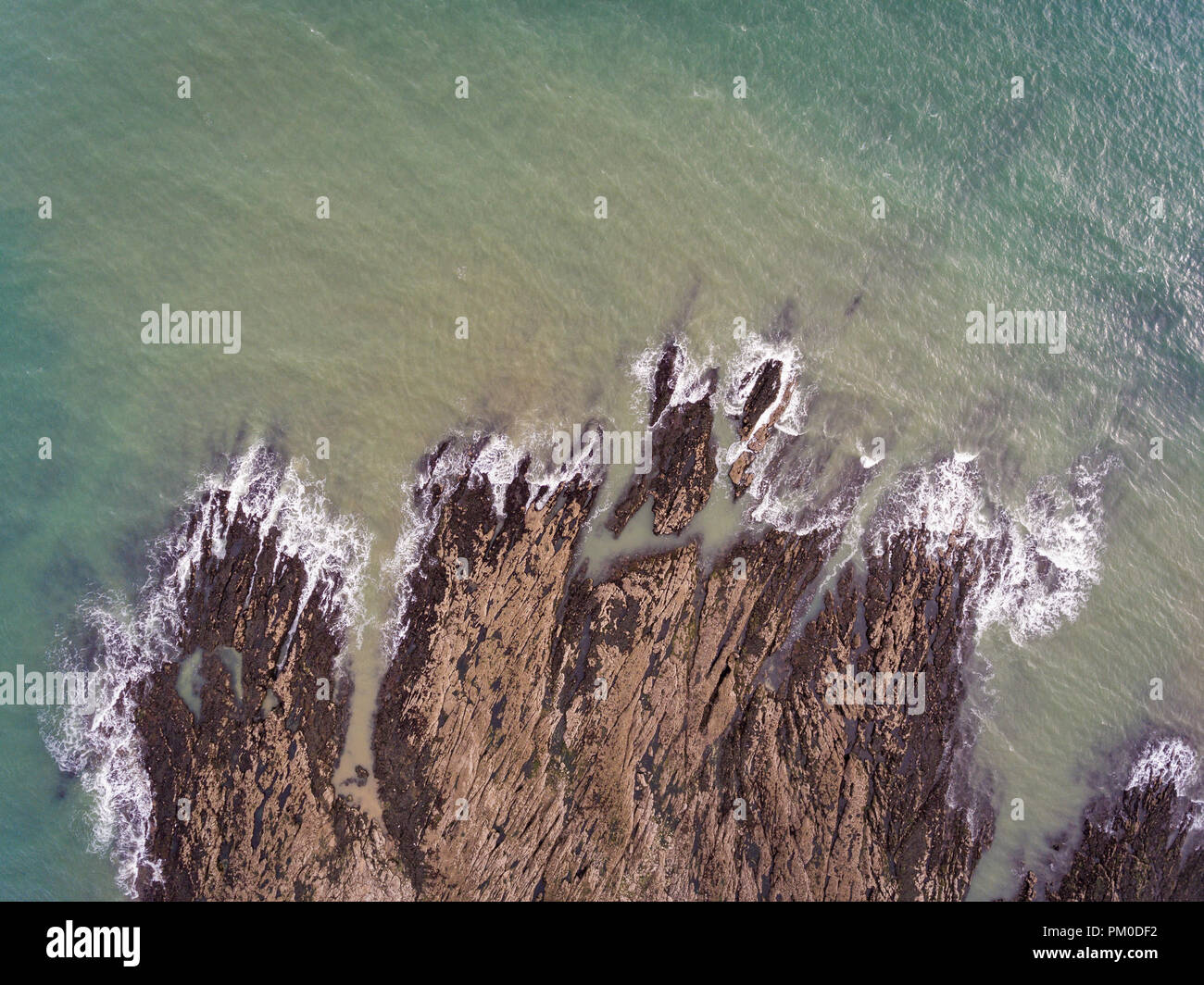 Aerial view of sea waves and fantastic Rocky coast at Mumbles, Swansea ...