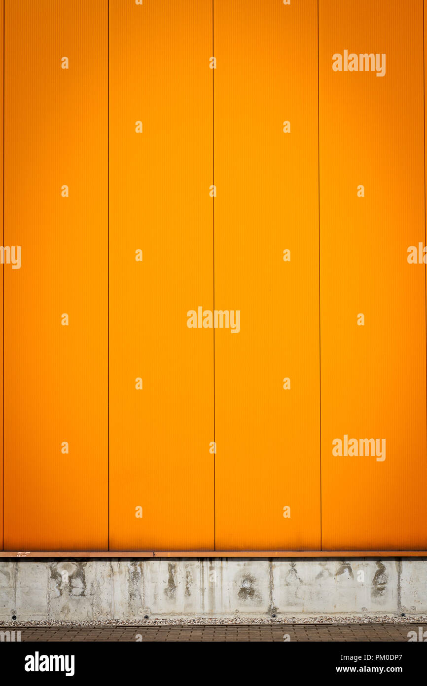 Orange color industrial warehouse wall. Urban background Stock Photo ...