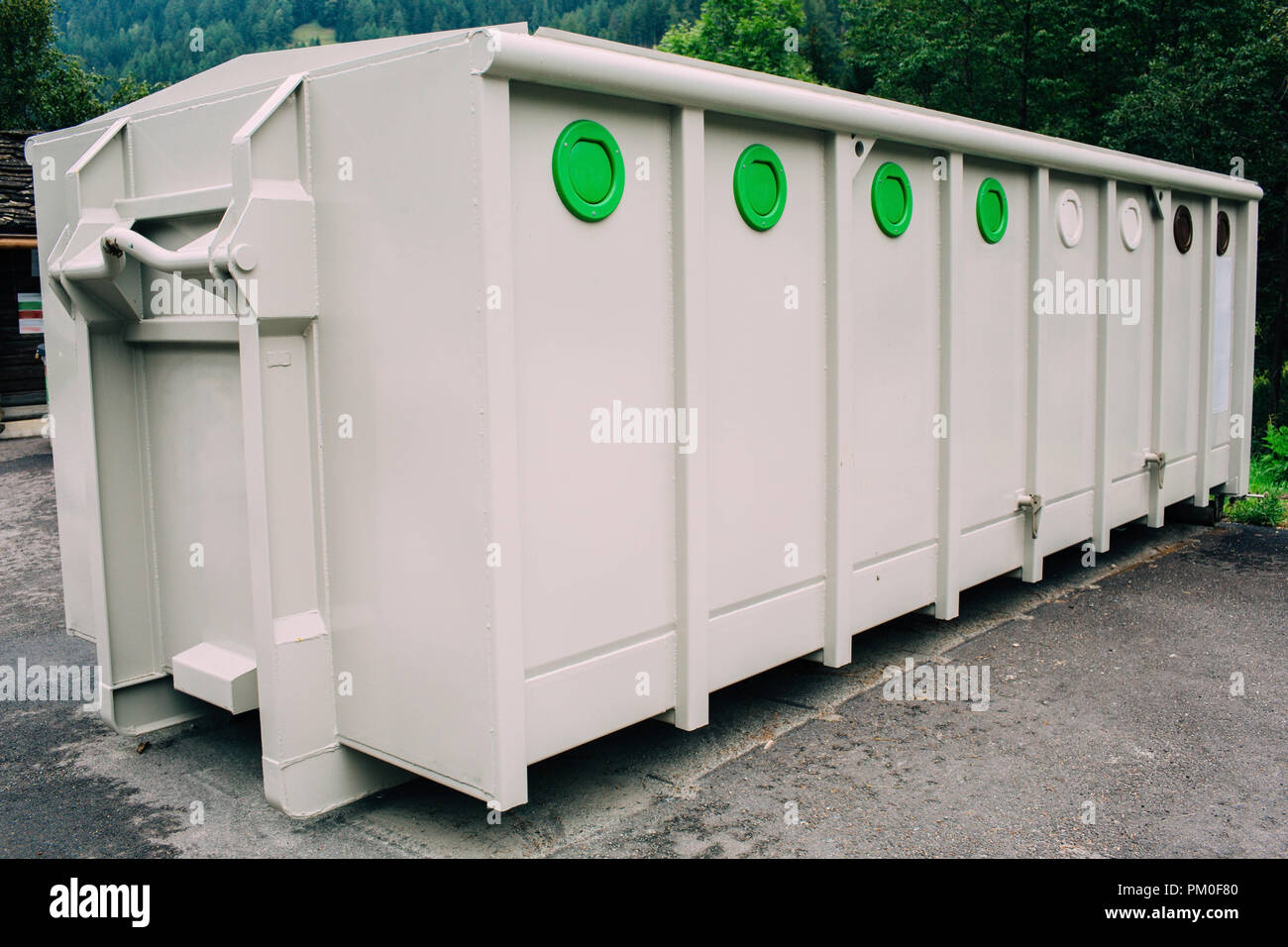 Selective garbage in Switzerland - sorting glass bottles of different ...