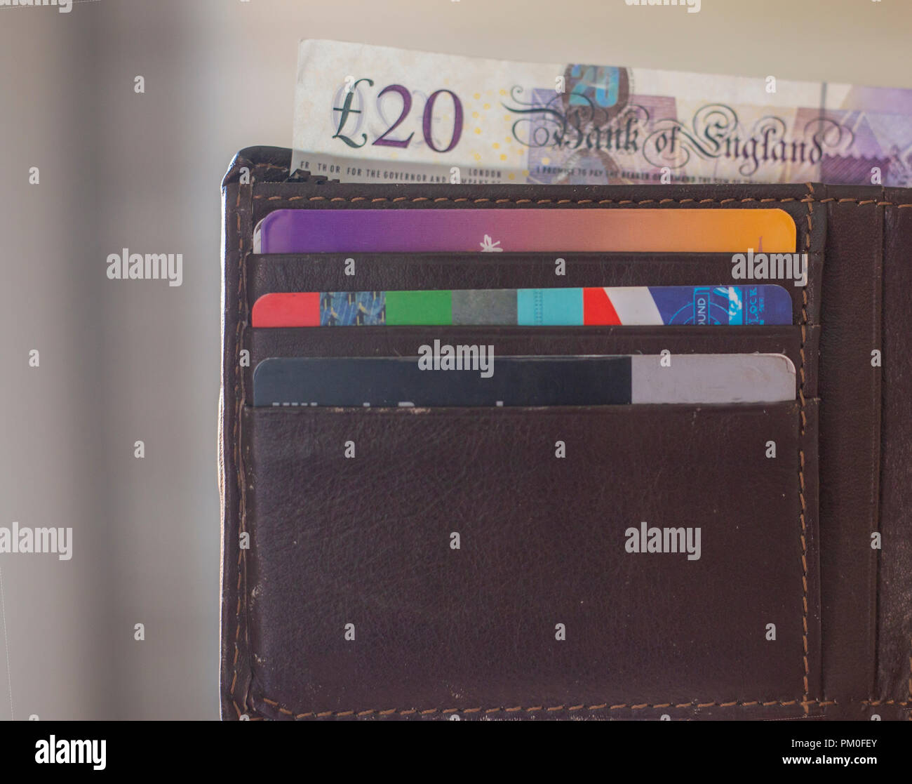 Money poking out of wallet hi-res stock photography and images - Alamy