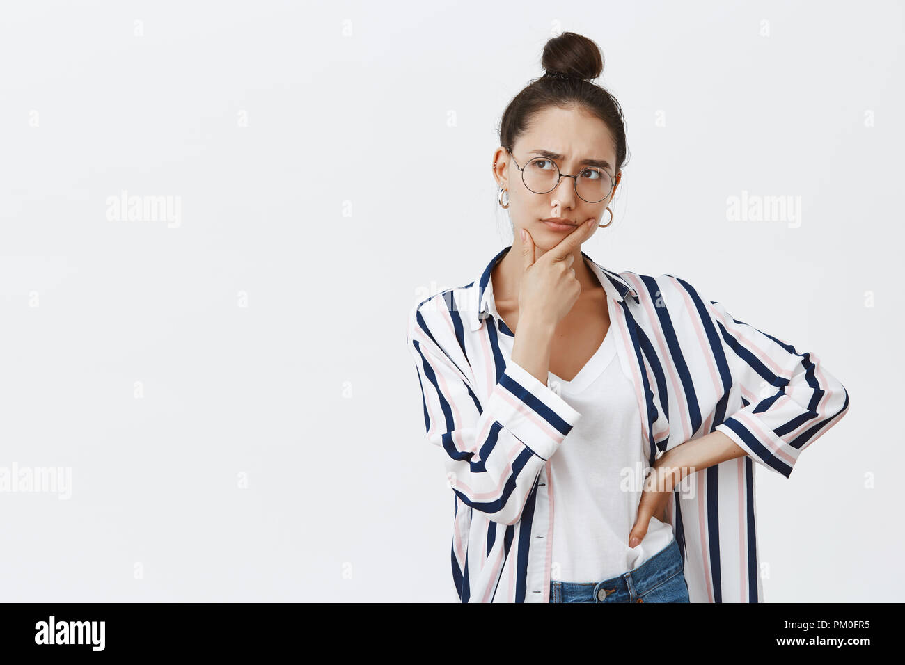 Attractive creative woman making up new idea for future design. Indoor ...